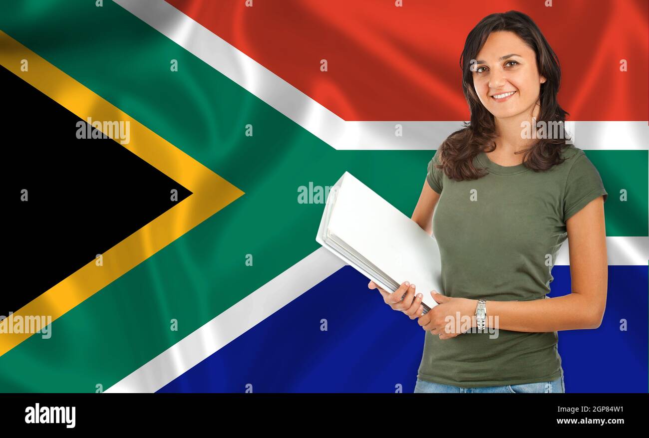 Young female student smiling over Greek flag Stock Photo - Alamy