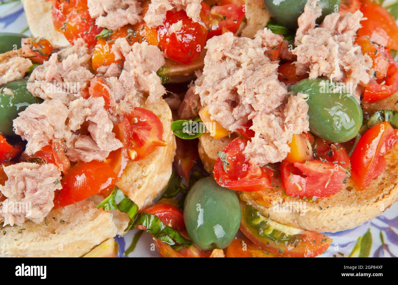Fresella italian bread with tuna and tomatoes Stock Photo - Alamy