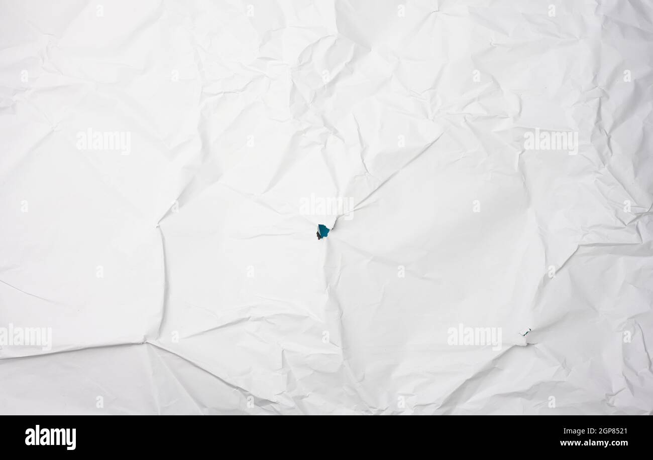 crumpled white paper, creases and a hole Stock Photo - Alamy