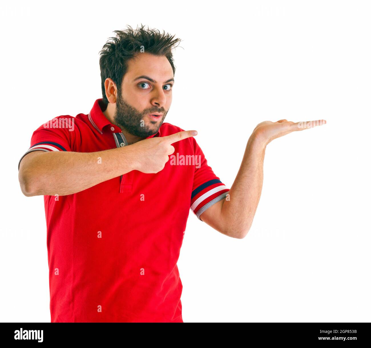 Man pointing with red t-shirt on white background Stock Photo - Alamy