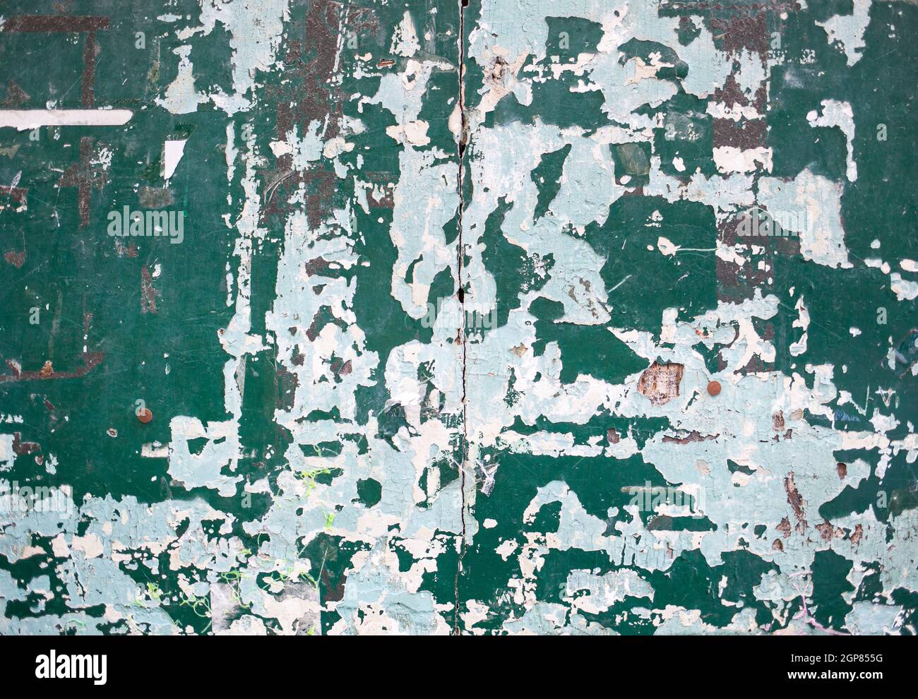 Green metal texture with patches of rust steel on its surface, taken ...