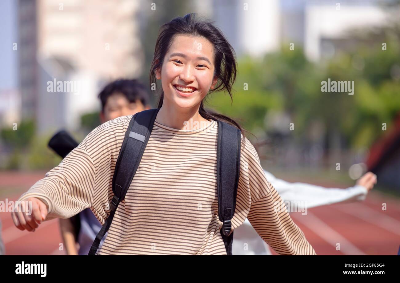 Group Of High School Students Running In school Stock Photo - Alamy