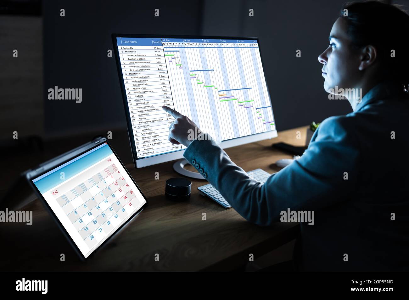 Employee Looking Calendar Schedule On Computer Screen Stock Photo - Alamy
