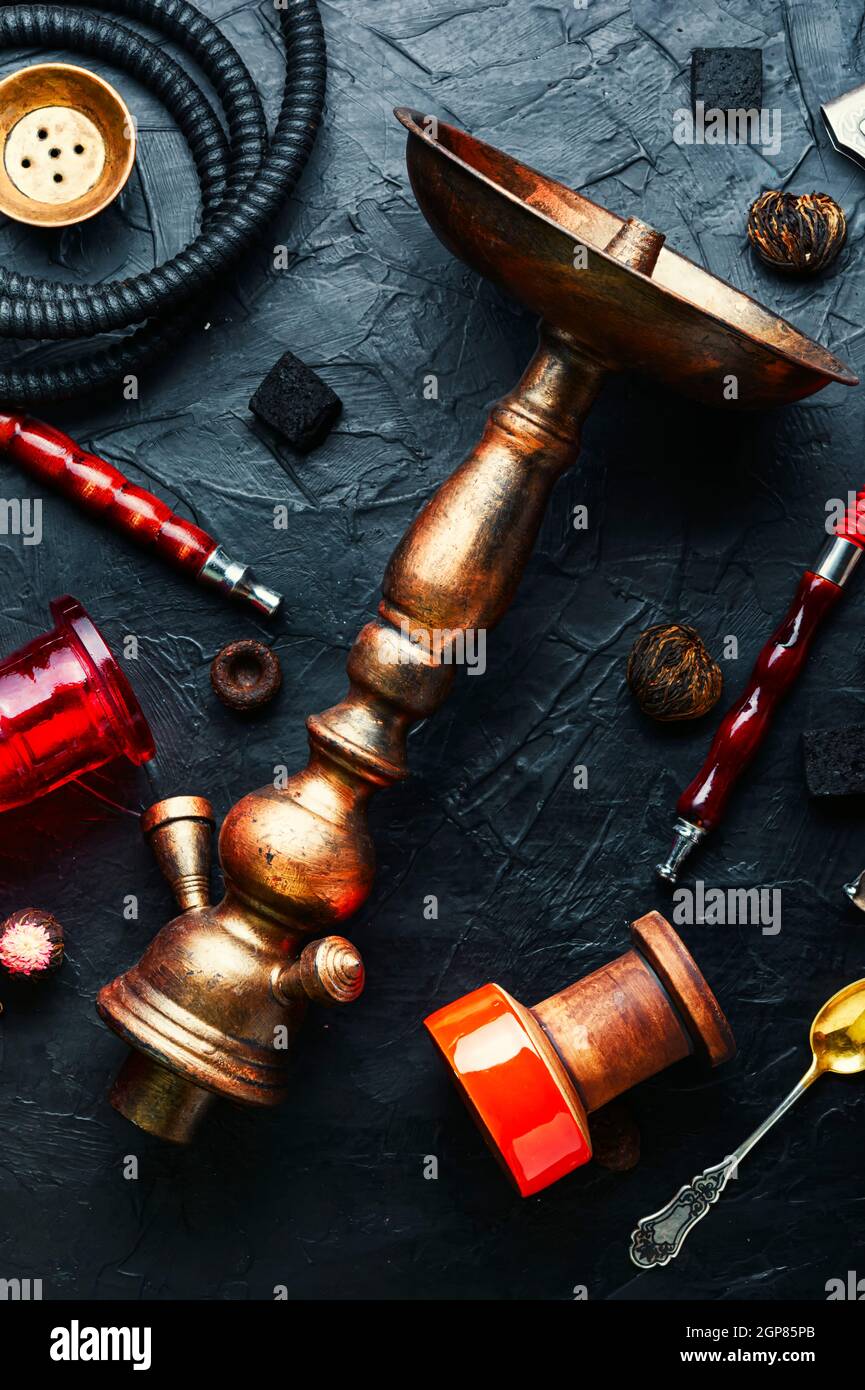 Eastern shisha or hookah for relaxation and teapot with tea Stock Photo ...