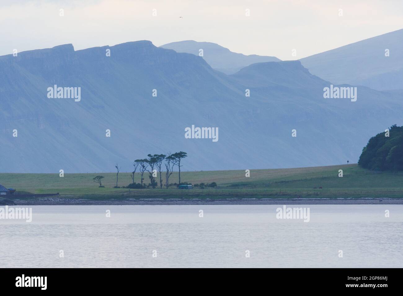 Dramatic scottish coastal cliffs, part of a telephoto landscape behind ...