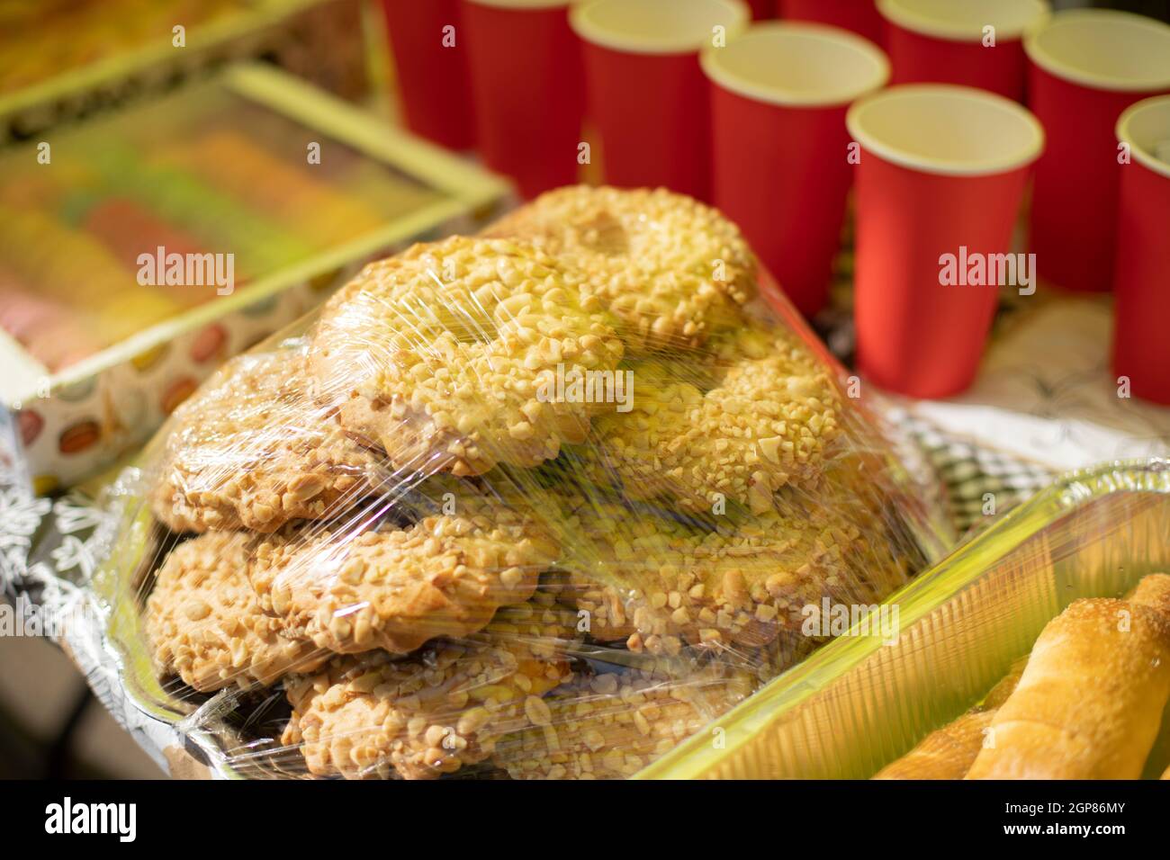 Sweets packed in film. Sale of delicious food. Boxes of sugar treats ...