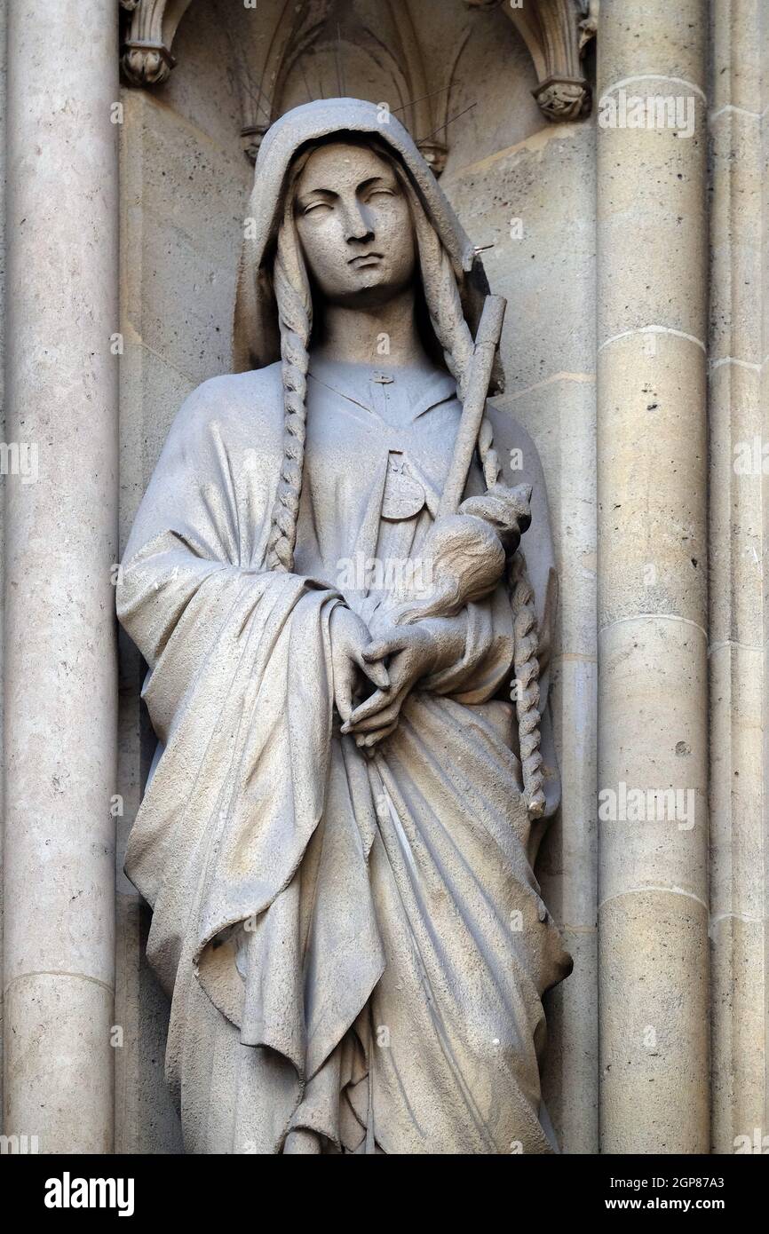 Saint Genevieve, statue on the portal of the Basilica of Saint Clotilde ...