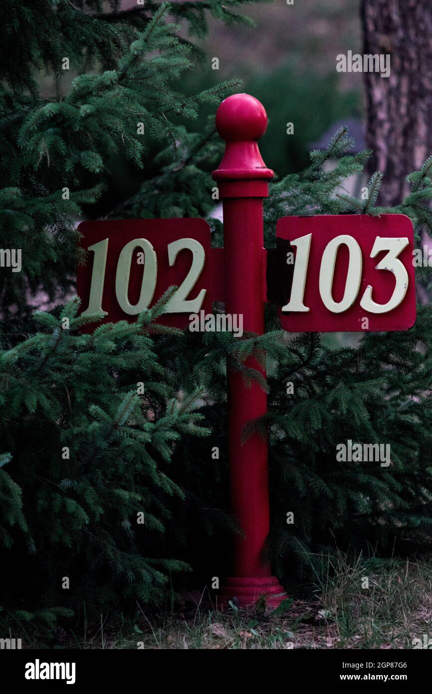 Parking number sign in a garden with nature in the background Stock ...