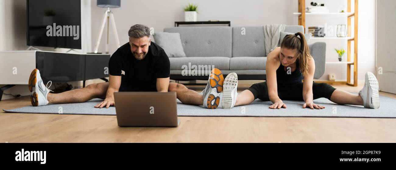 Online Laptop Home Fitness Workout And Exercise Stock Photo - Alamy