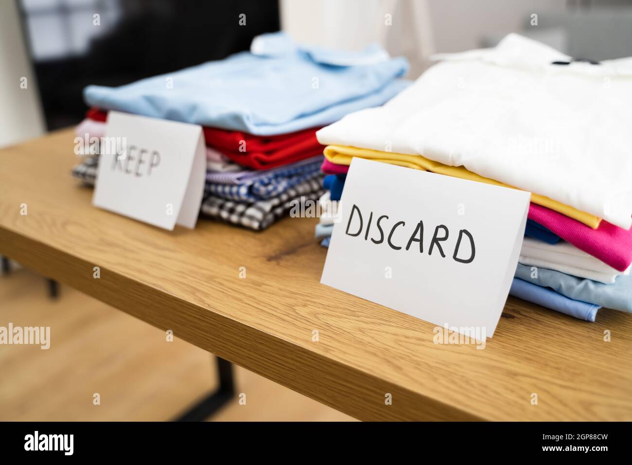 Tidying Sorting Fashion Clothes And Shirts. Purge Concept Stock Photo ...