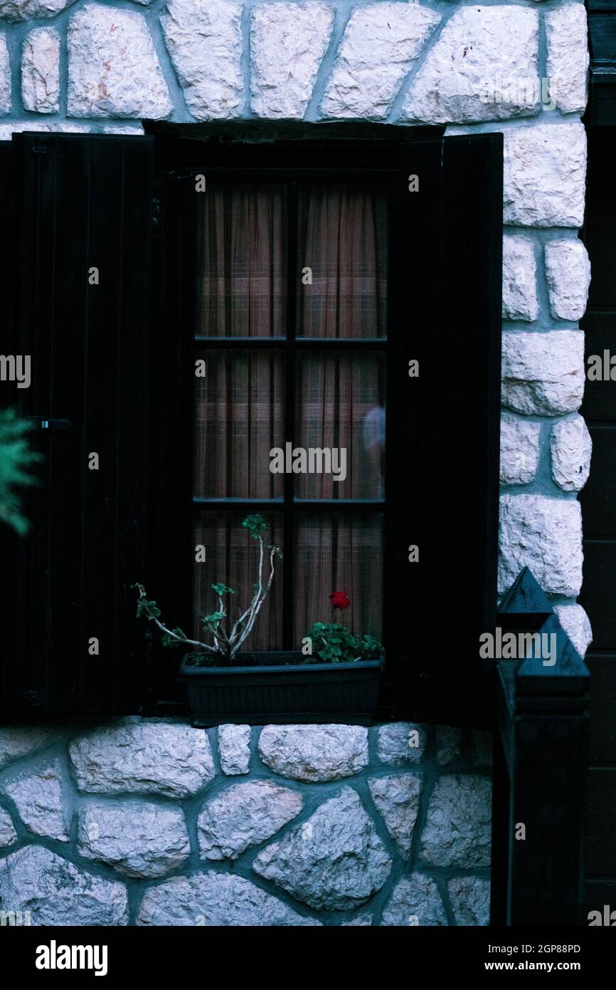 A wooden window of a rock house Stock Photo - Alamy
