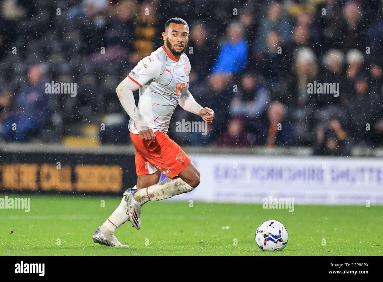 Hull, UK. 28th Sep, 2021. Keshi Anderson #10 of Blackpool breaks with ...