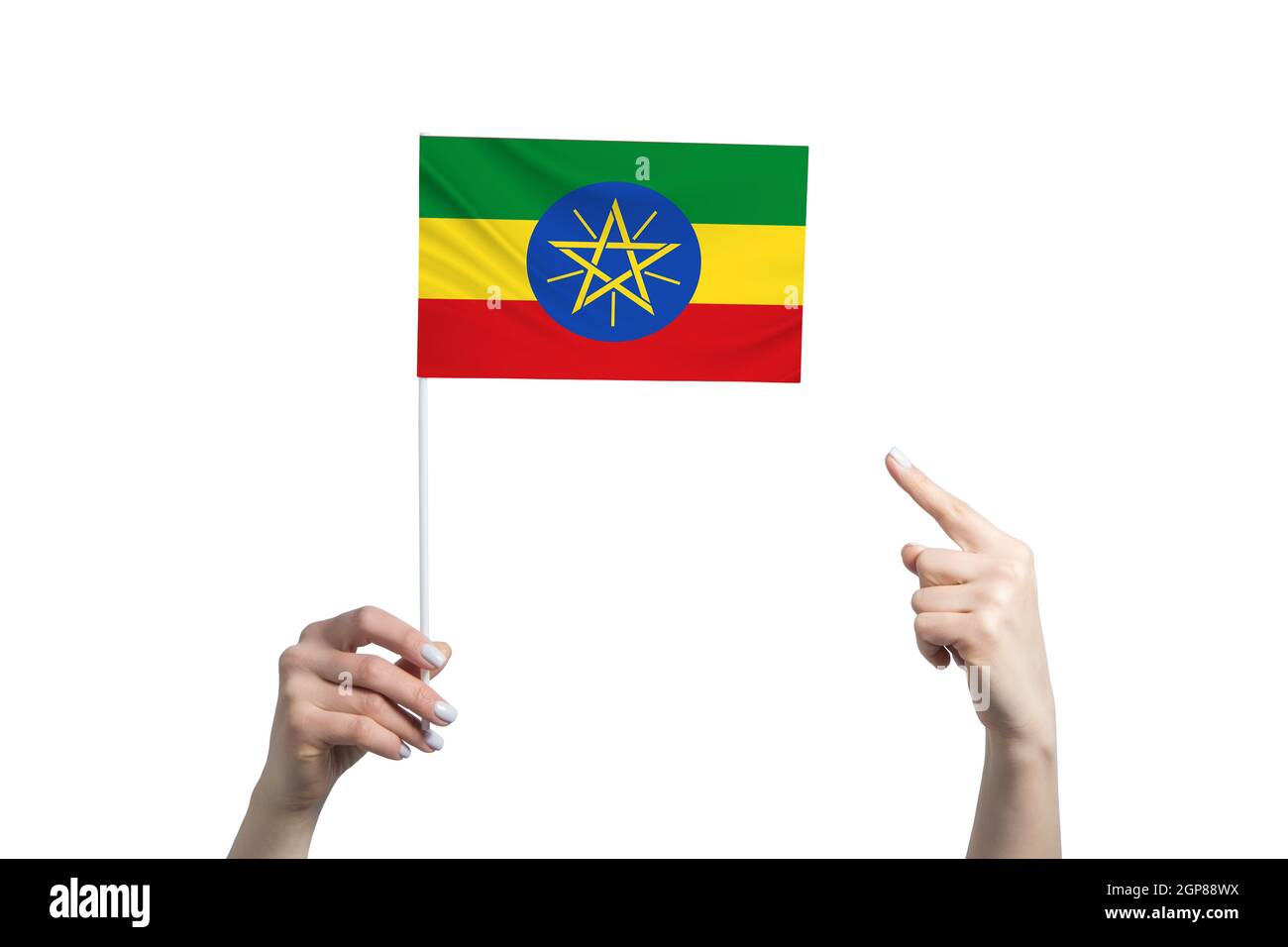A beautiful female hand holds a Ethiopia flag to which she shows the ...