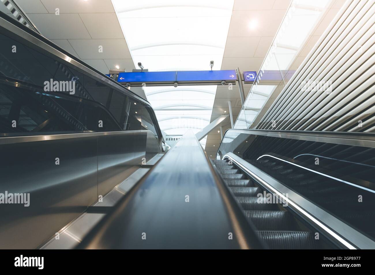 Travelling scene on train station, moving stairway for public transport ...