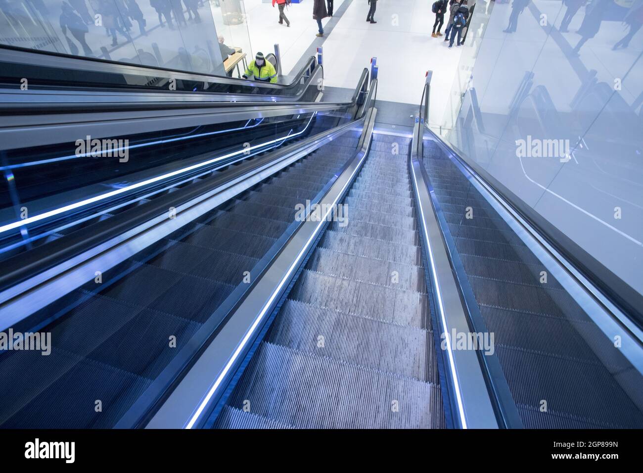 Travelling scene on train station, moving stairway for public transport ...