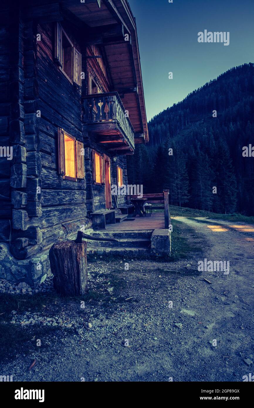 Rustic wooden farm hut in the night. European alps, Austria Stock Photo ...