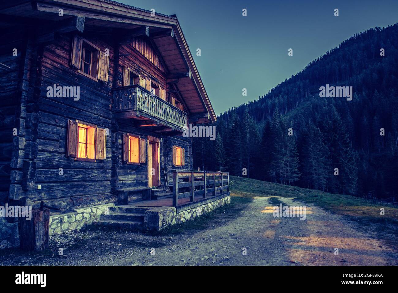 Rustic wooden farm hut in the night. European alps, Austria Stock Photo ...