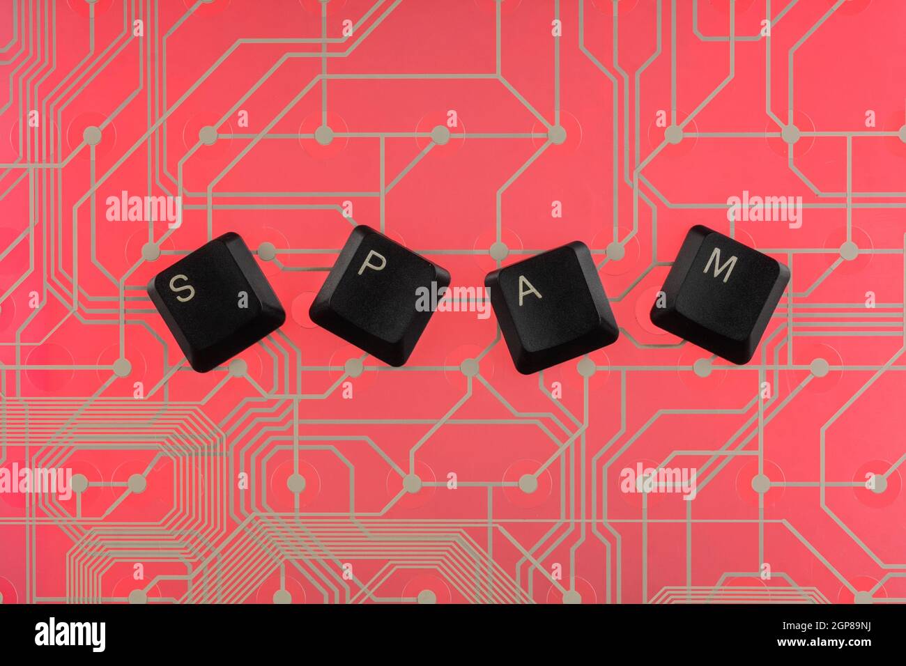 Keyboard keys laid out the word spam on a red background Stock Photo ...