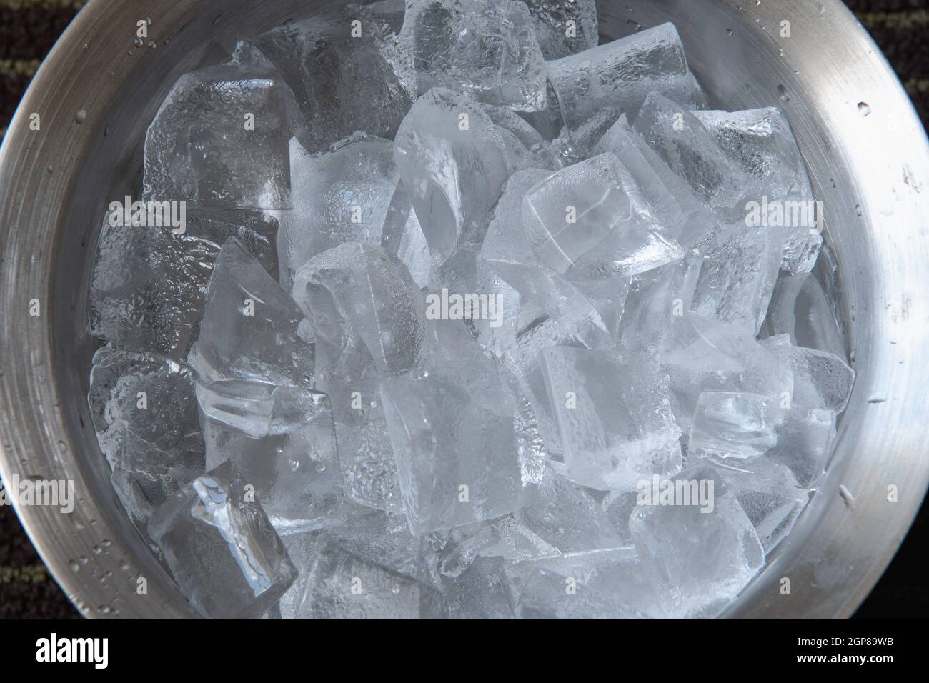 Ice cubes in metal bucket. Select focus. Frozen water. Ice for drinks ...
