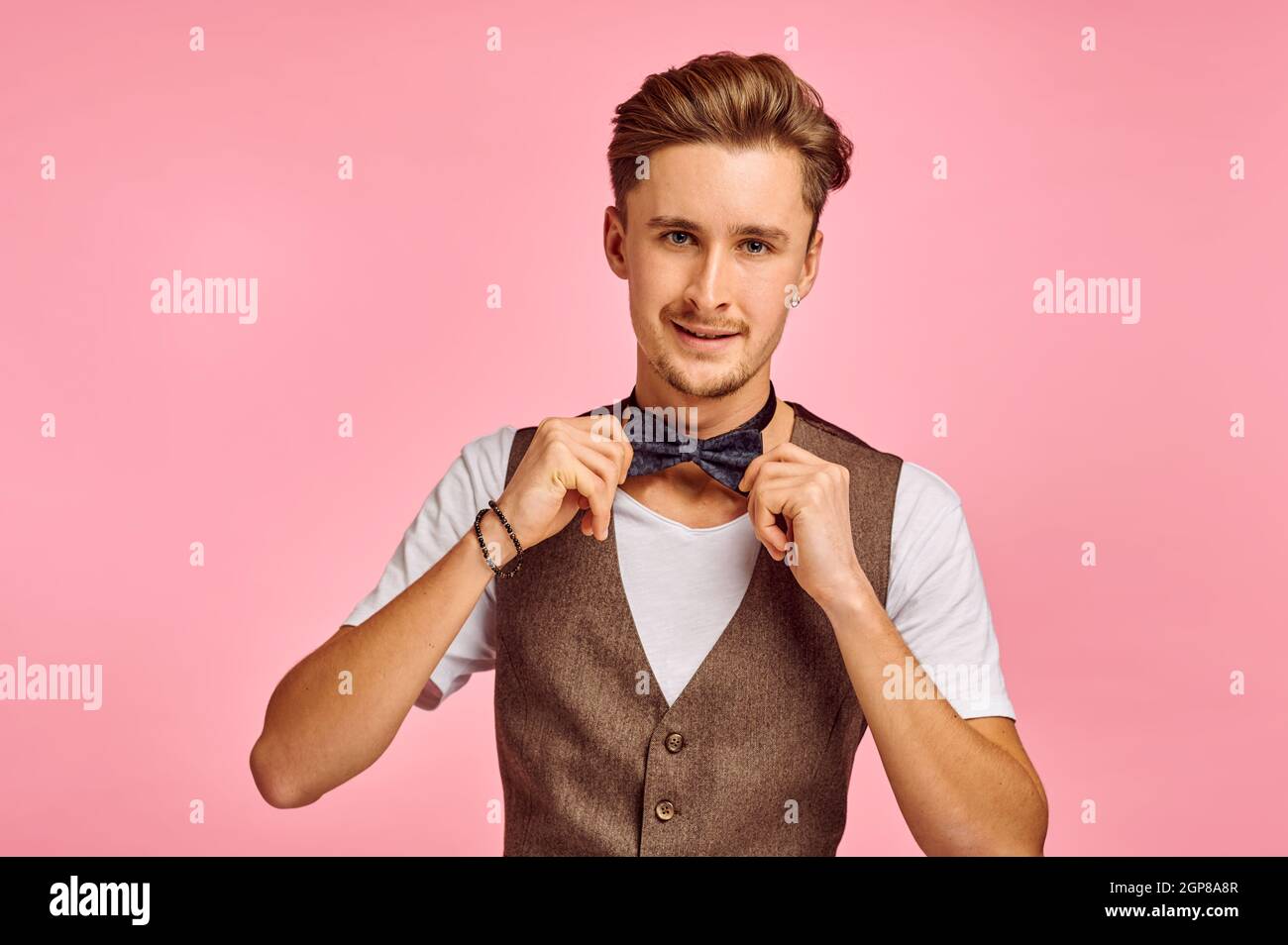 Portrait of a man with an exultant look, pink background, emotion. Face ...