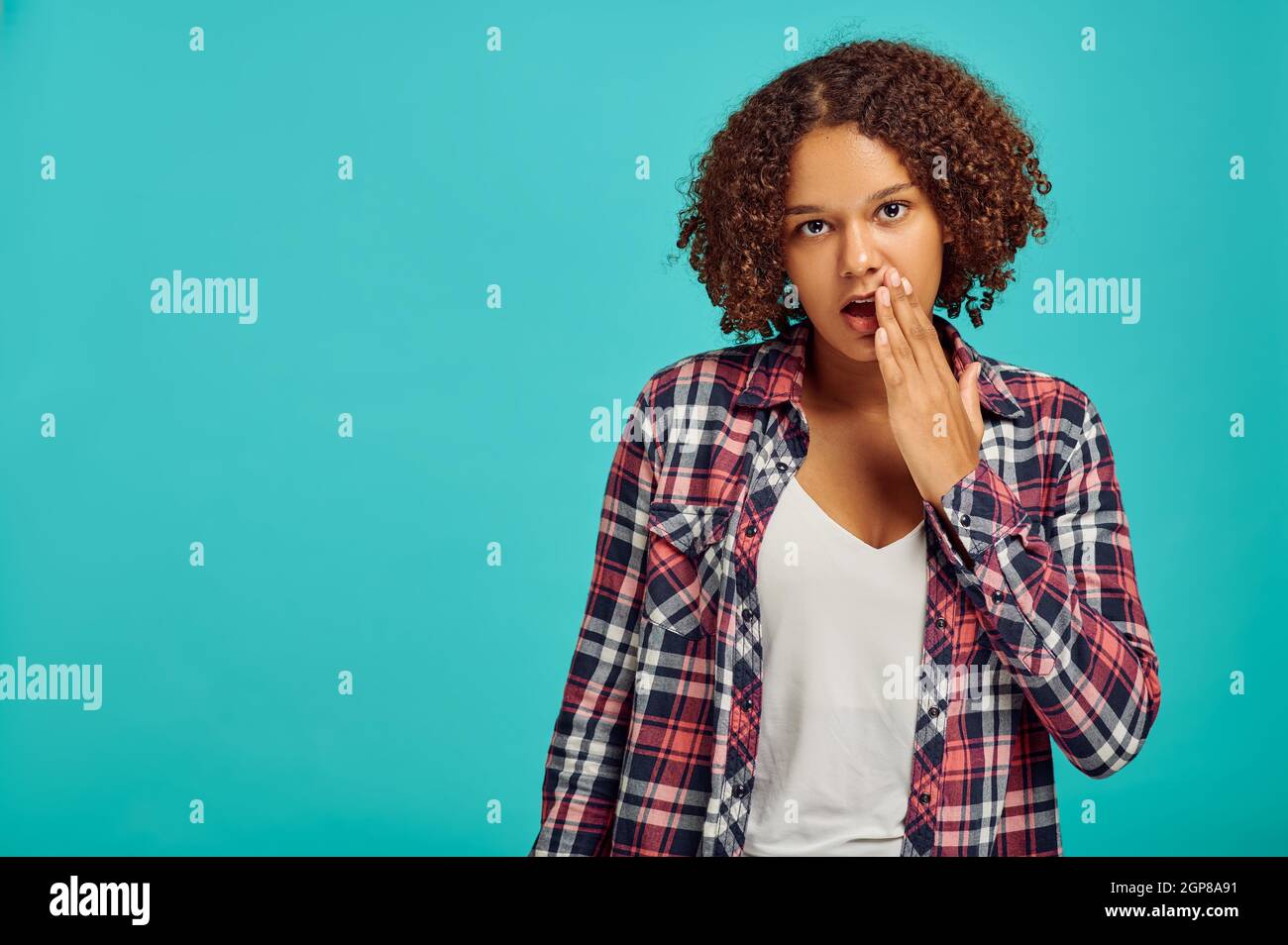 Surprised young woman portrait, blue background, wow emotion. Face ...
