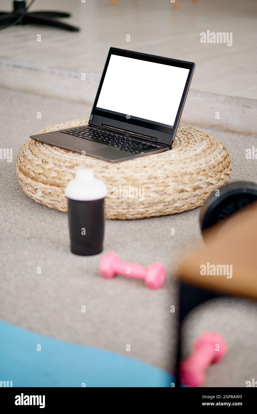 Online fitness or pilates training with laptop concept, nobody ...