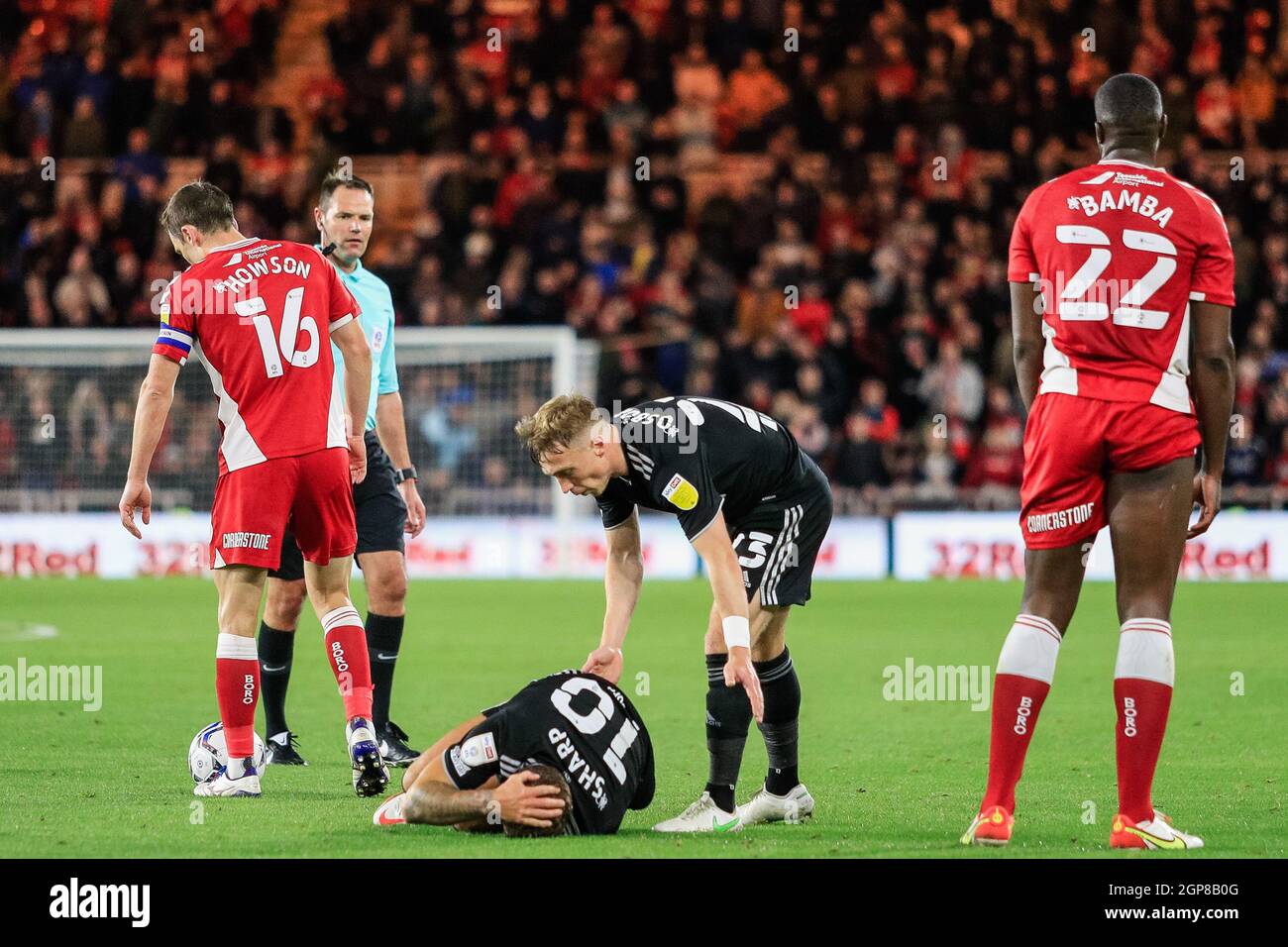 Ben Osborn #23 of Sheffield United helps Billy Sharp #10 of Sheffield ...