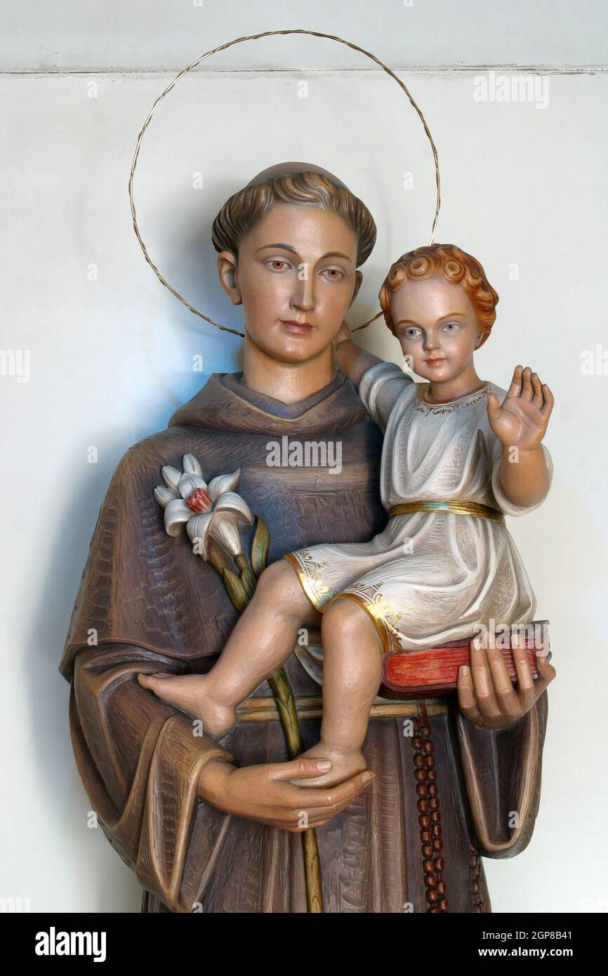 Saint Anthony holds a child of Jesus, a statue in the parish church of ...