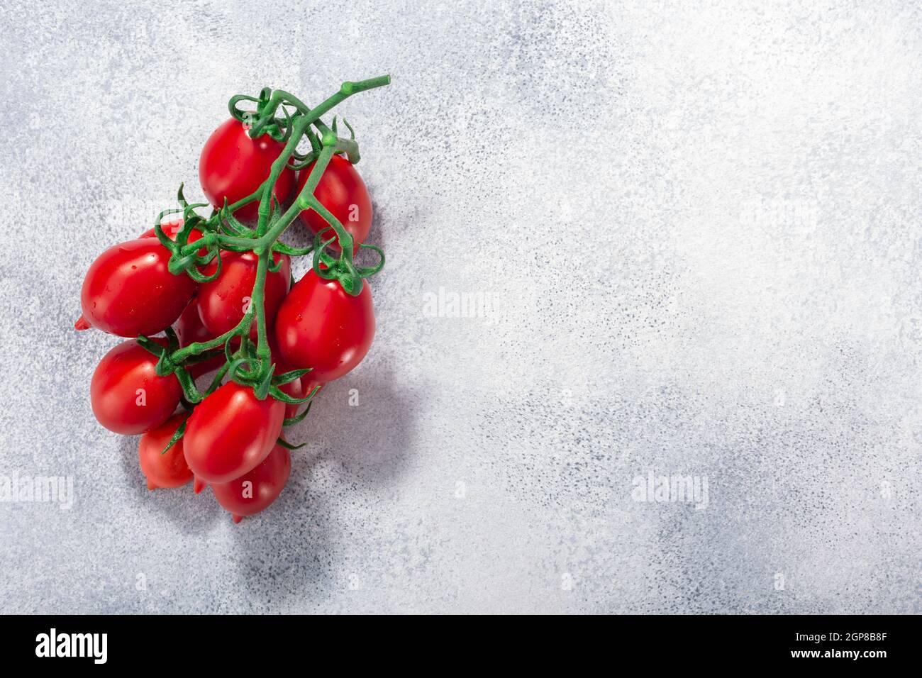 Piennolo del Vesuvio Italian heirloom tomatoes in clusters on the vine ...