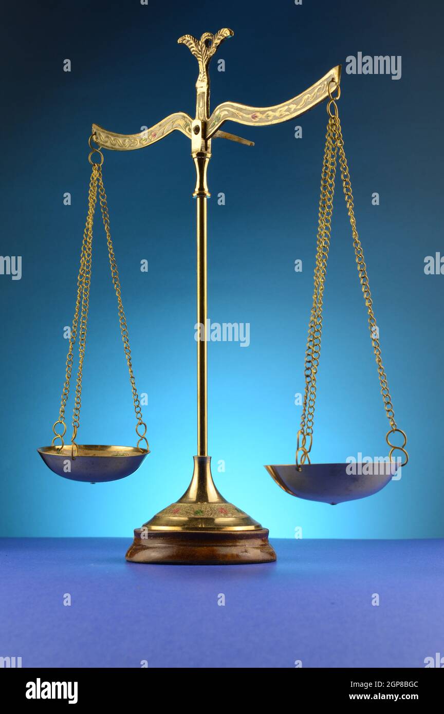 A stylish weigh scales with the two arms of chained bucket setup Stock ...