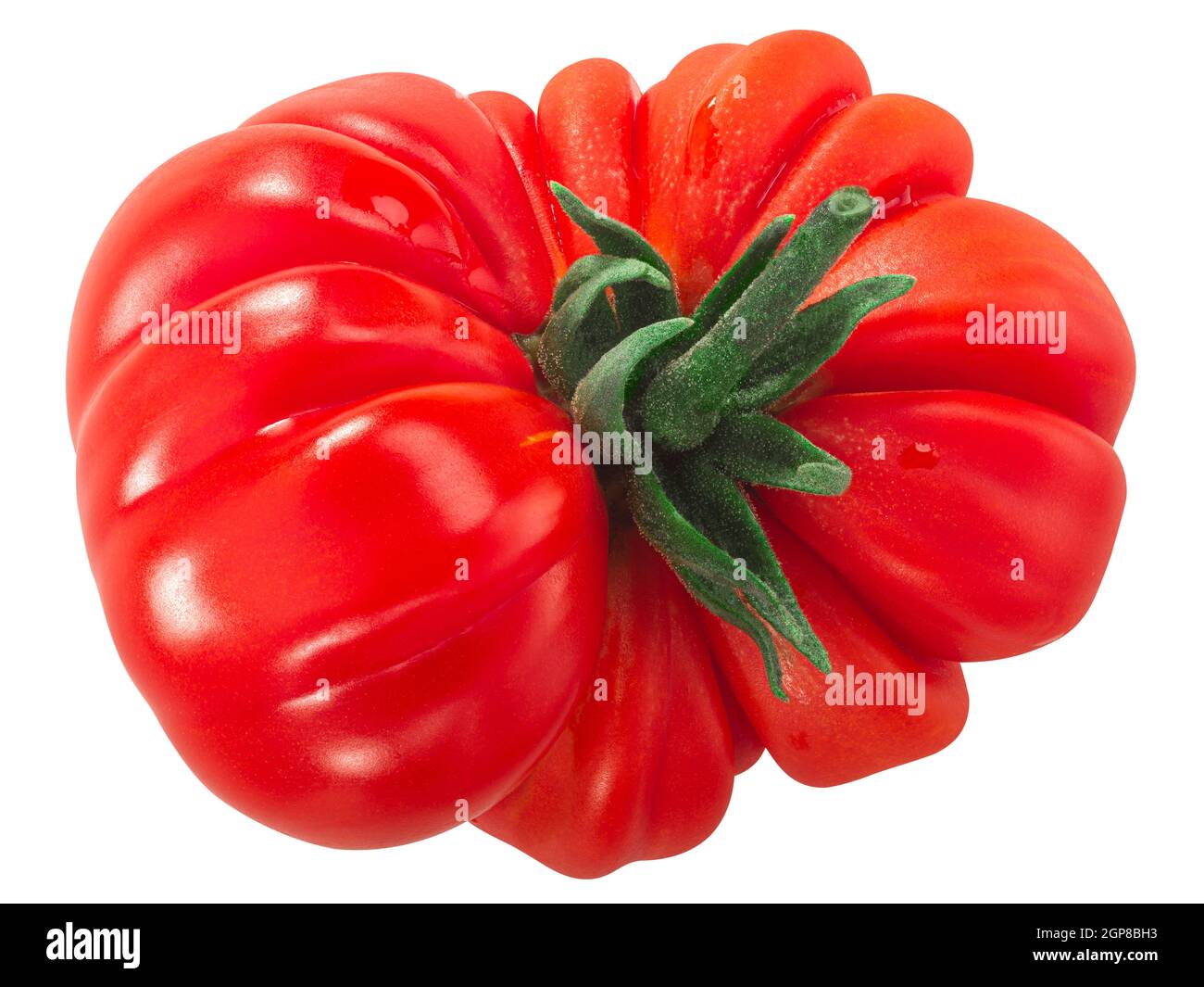 Heirloom ribbed tomato (Solanum lycopersicum fruit), top view, isolated ...