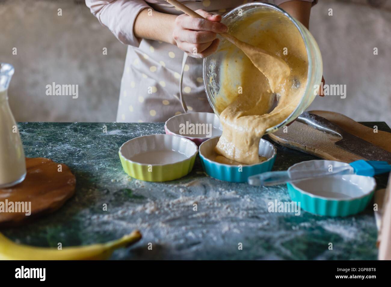 Woman pouring homemade raw batter hi-res stock photography and images ...