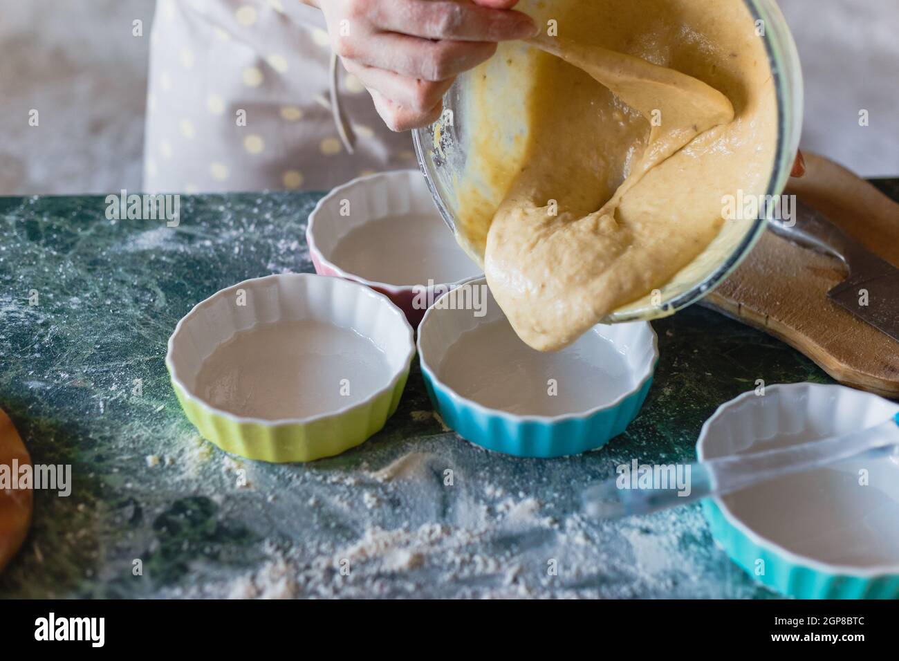 Woman pouring homemade raw batter hi-res stock photography and images ...