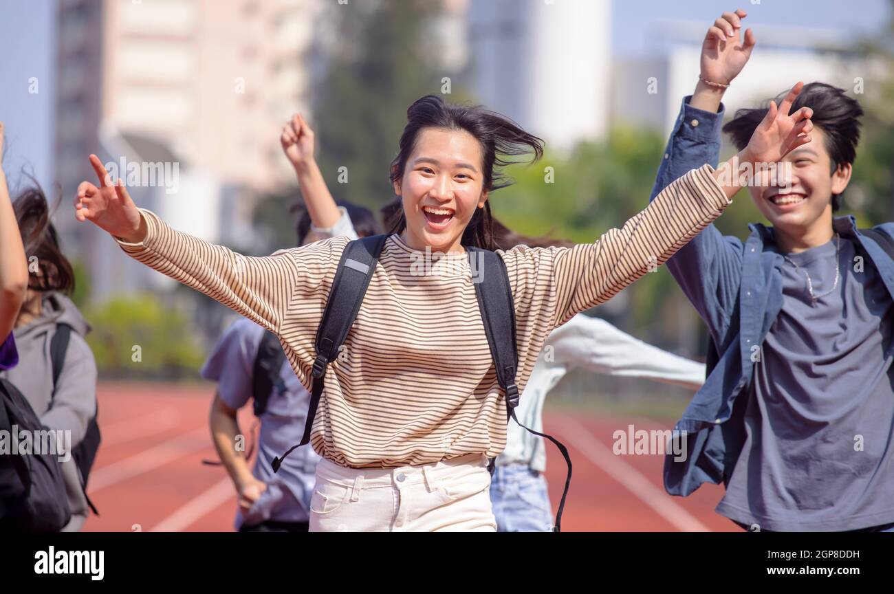 Happy teenager Students Running In school Stock Photo - Alamy