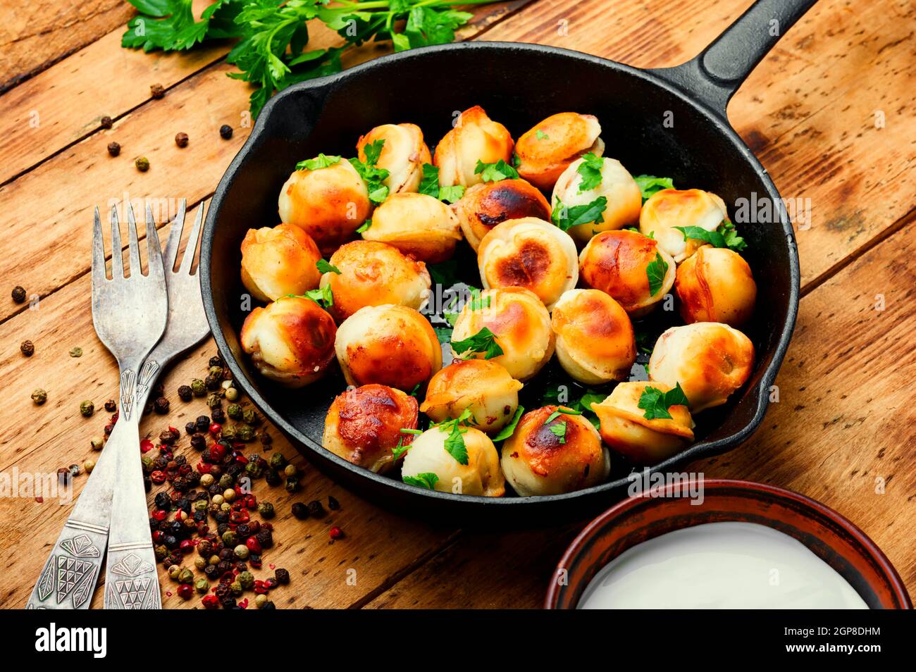 Frying pan with roasted tasty pelmeni.Fried dumplings Stock Photo - Alamy