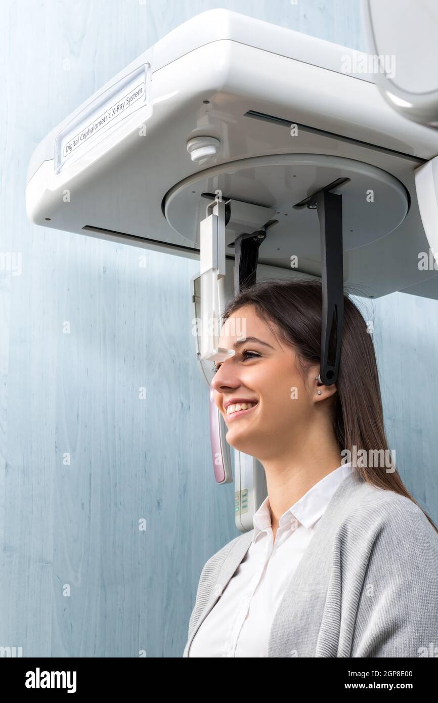 Close up side view portrait of woman taking dental examination with ...