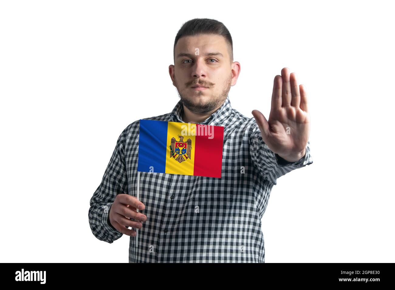 White guy holding a flag of Moldova and with a serious face shows a ...