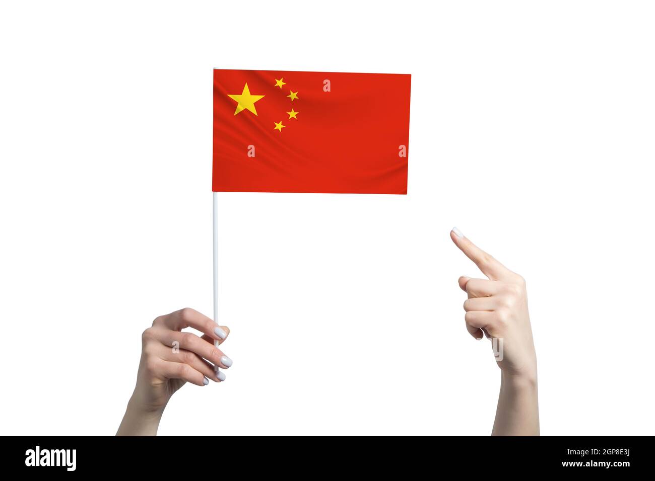 A beautiful female hand holds a People's Republic of China flag to ...