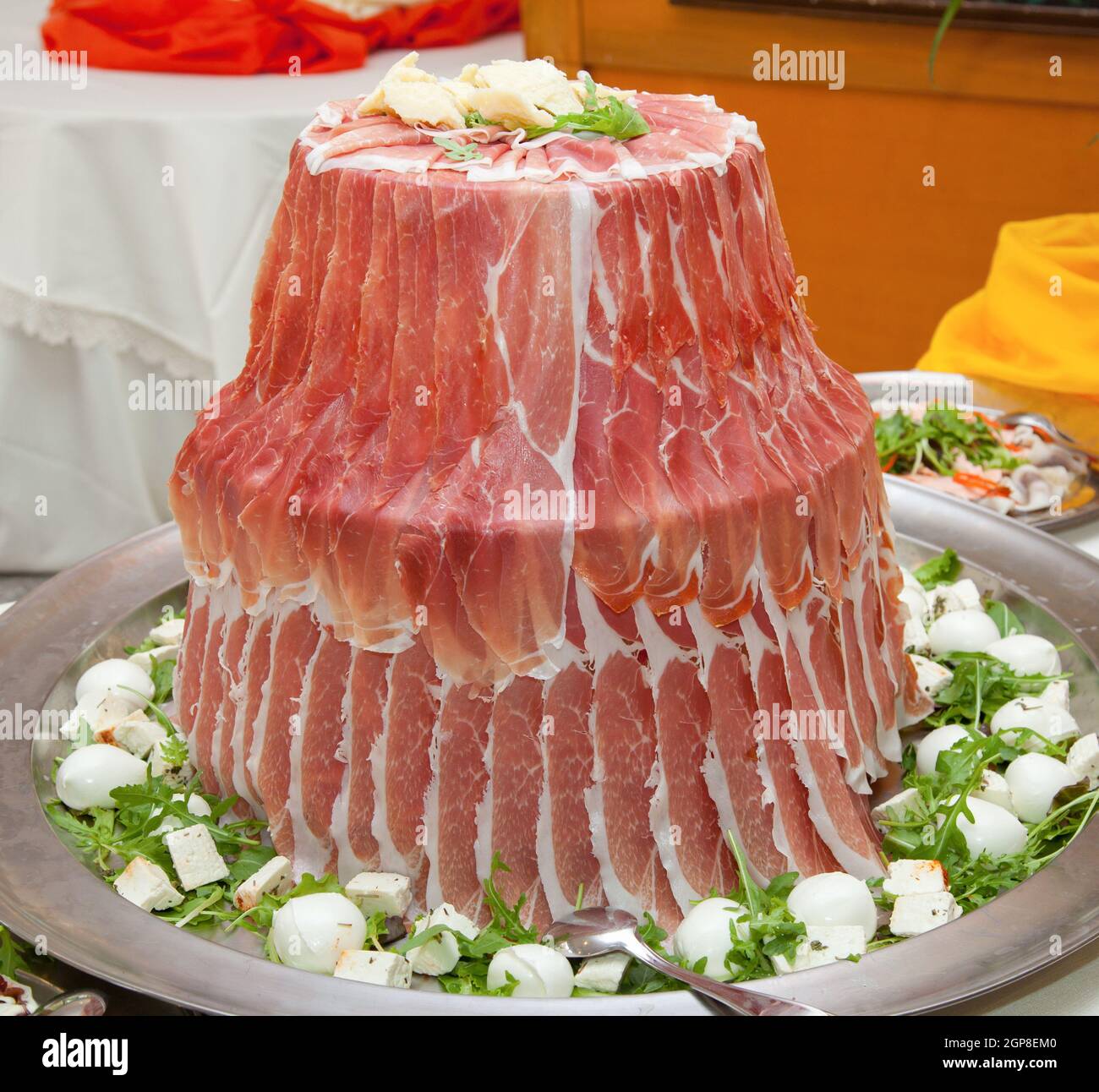 Raw ham arranged like a fountain, Italian buffet Stock Photo - Alamy