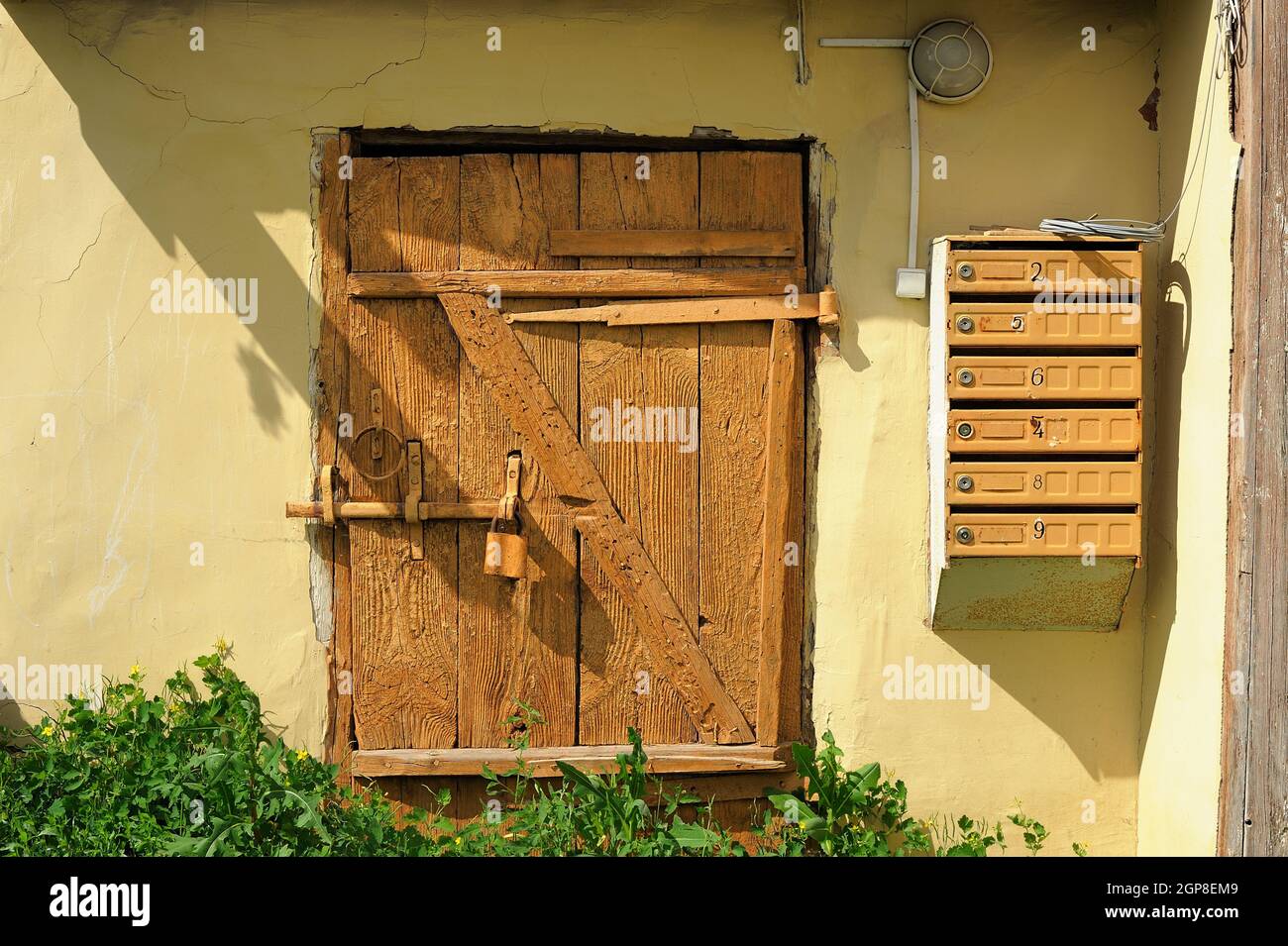 Old wooden door shut by outboard lock horizontal Stock Photo - Alamy