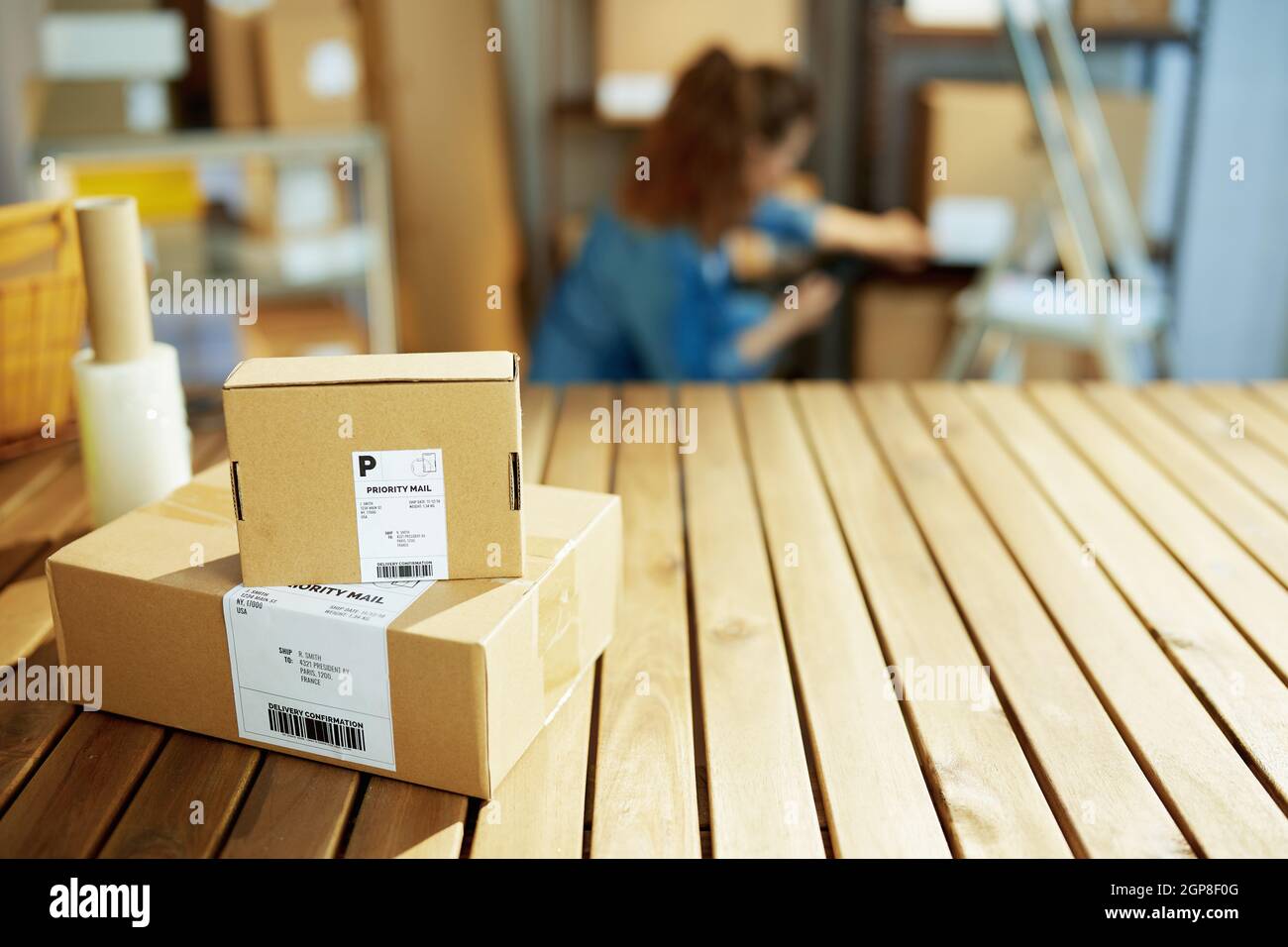 Delivery business. table with parcels in the office Stock Photo - Alamy