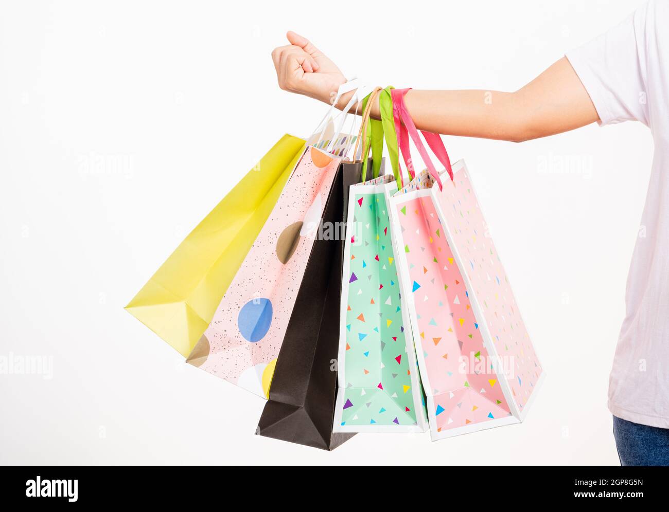 Closeup women hand holding colorful multicolor shopping bag many ...