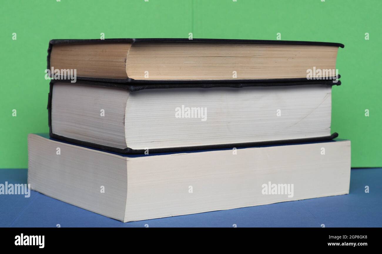 pile of books in a public library Stock Photo - Alamy