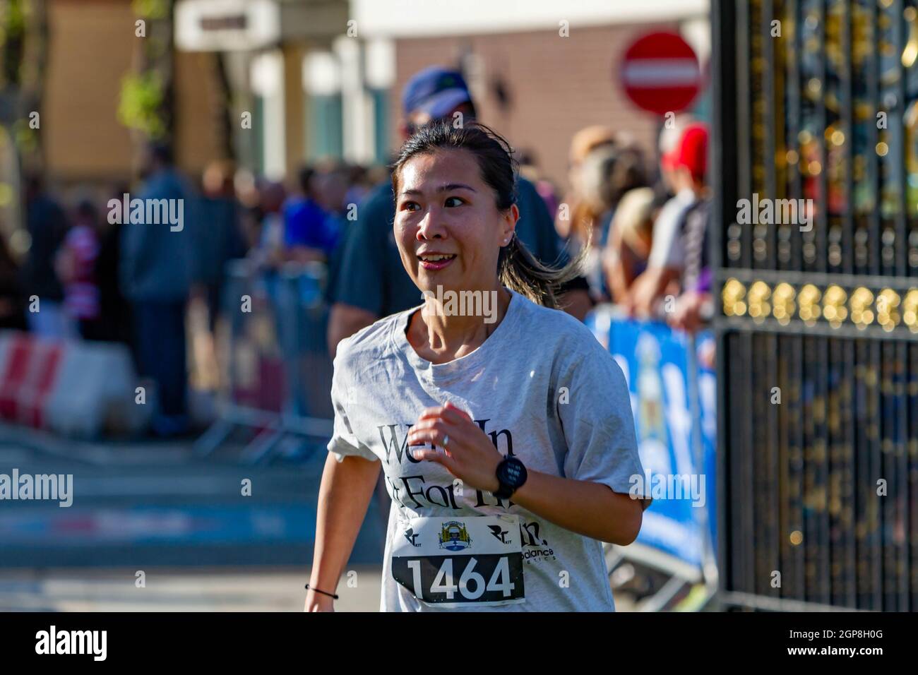 Female athlete crossing finish line hi-res stock photography and images ...