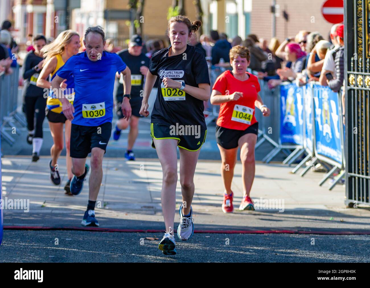 Female athlete crossing finish line hi-res stock photography and images ...