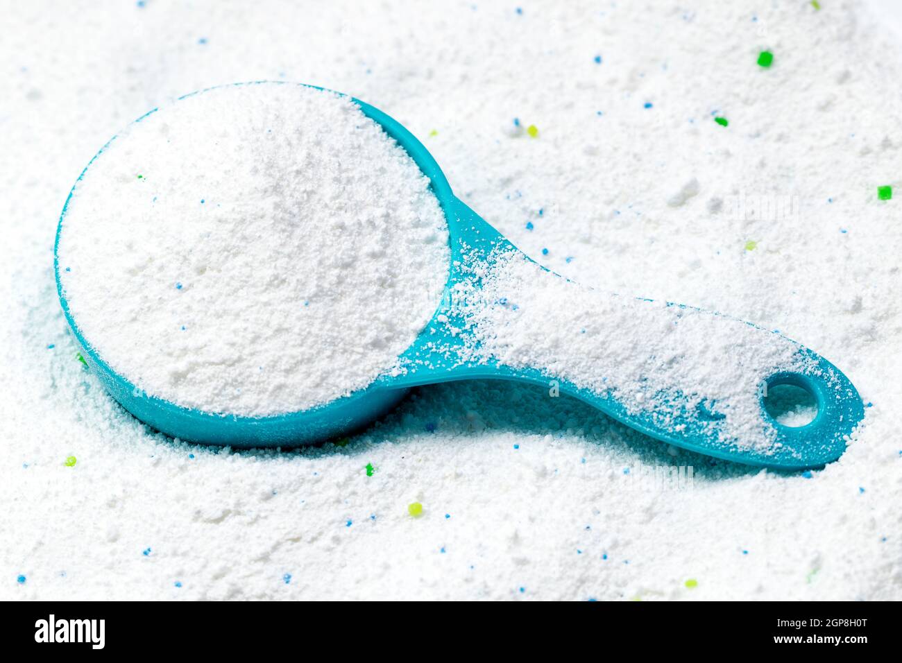 Blue cup or scoop of white powder Detergent for clothes washing Stock ...
