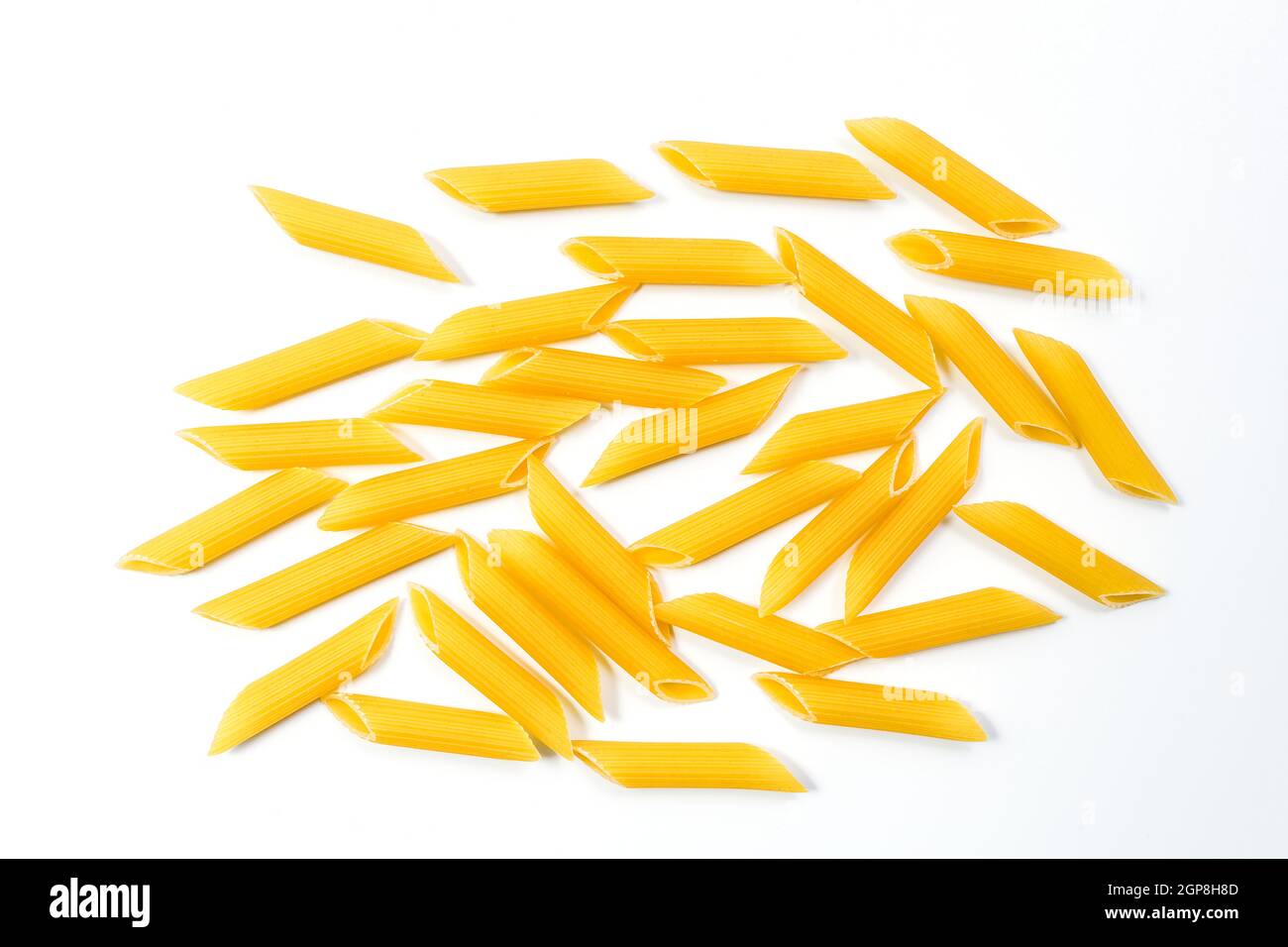 Raw uncooked Italian penne rigate pasta isolated on white background ...