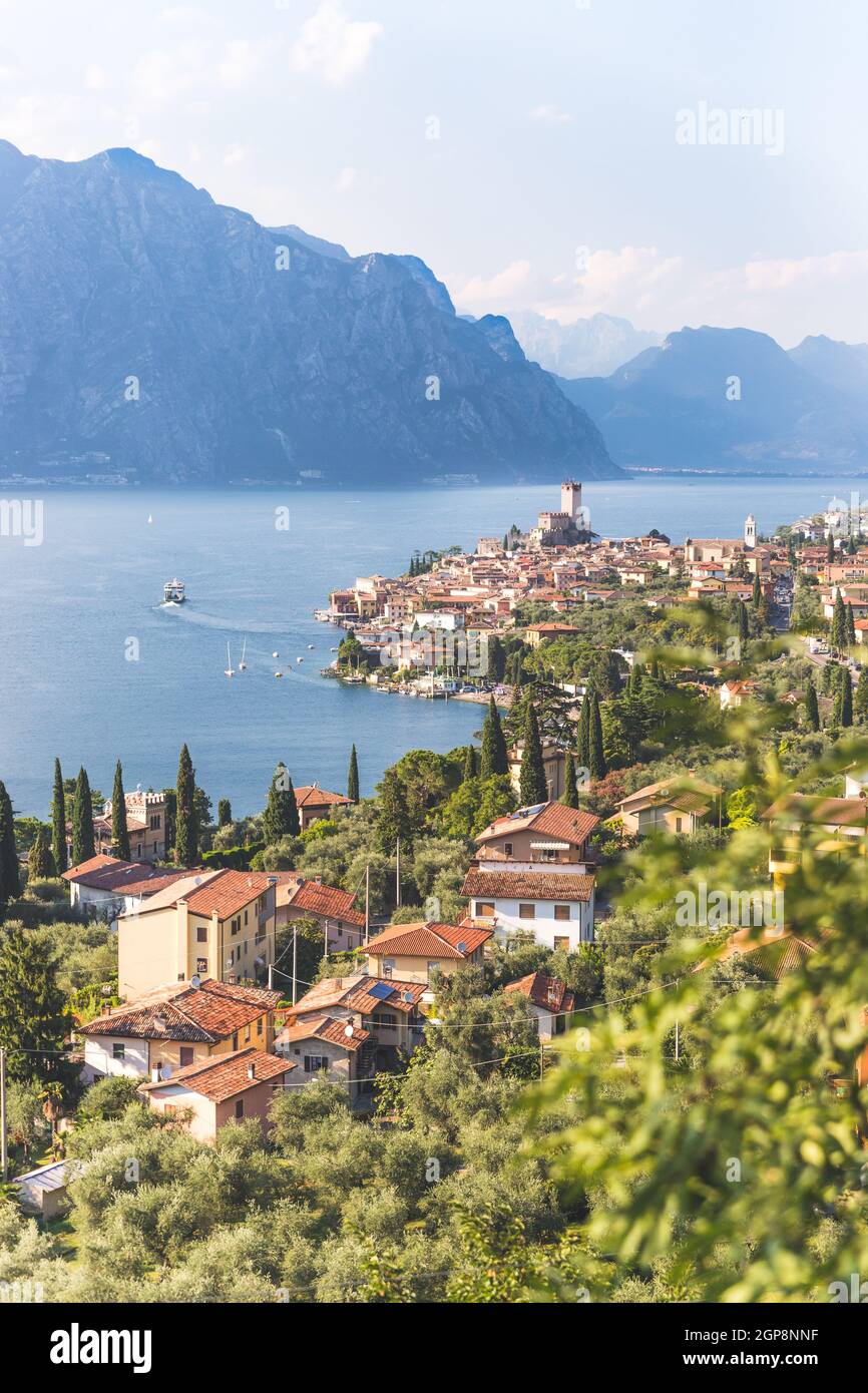 Cute idyllic Italian village and lake captured from above. Malcesine at ...