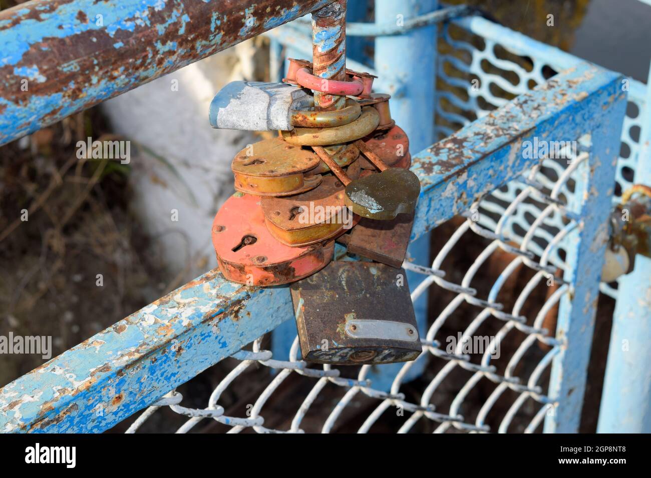 Love locks hung by newlyweds and lovers on the fence near the river. A ...