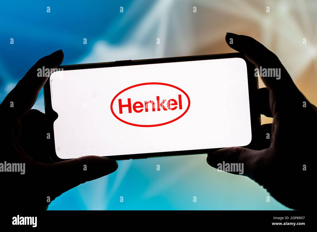 In this photo illustration, a Henkel logo seen displayed on a ...